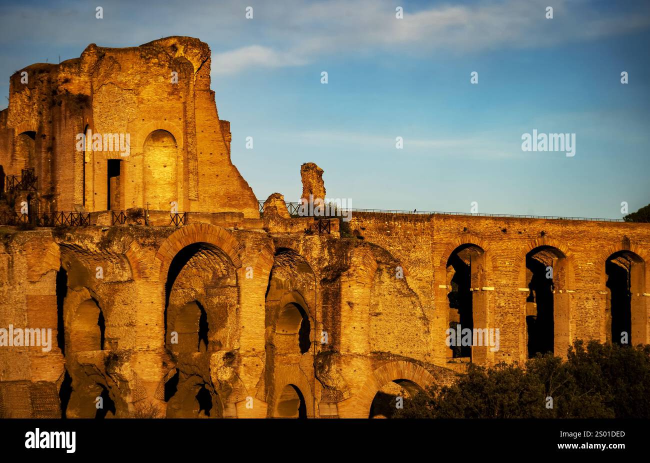 Ruins of an ancient structure with arches and stone walls, illuminated ...