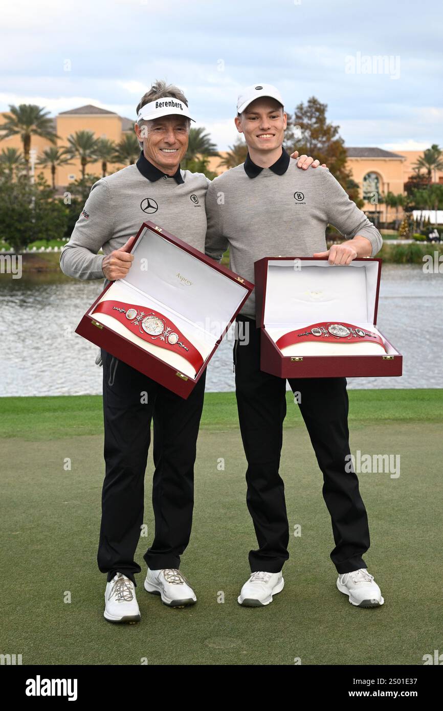 Bernhard Langer, left, and his son Jason Langer pose with the championship belts after winning ...