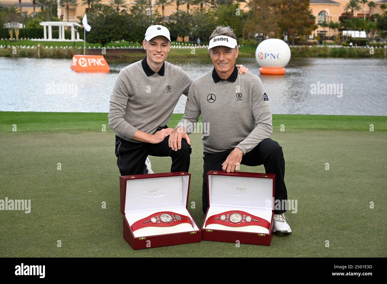 Bernhard Langer, right, and his son Jason Langer pose with the championship belts after winning ...