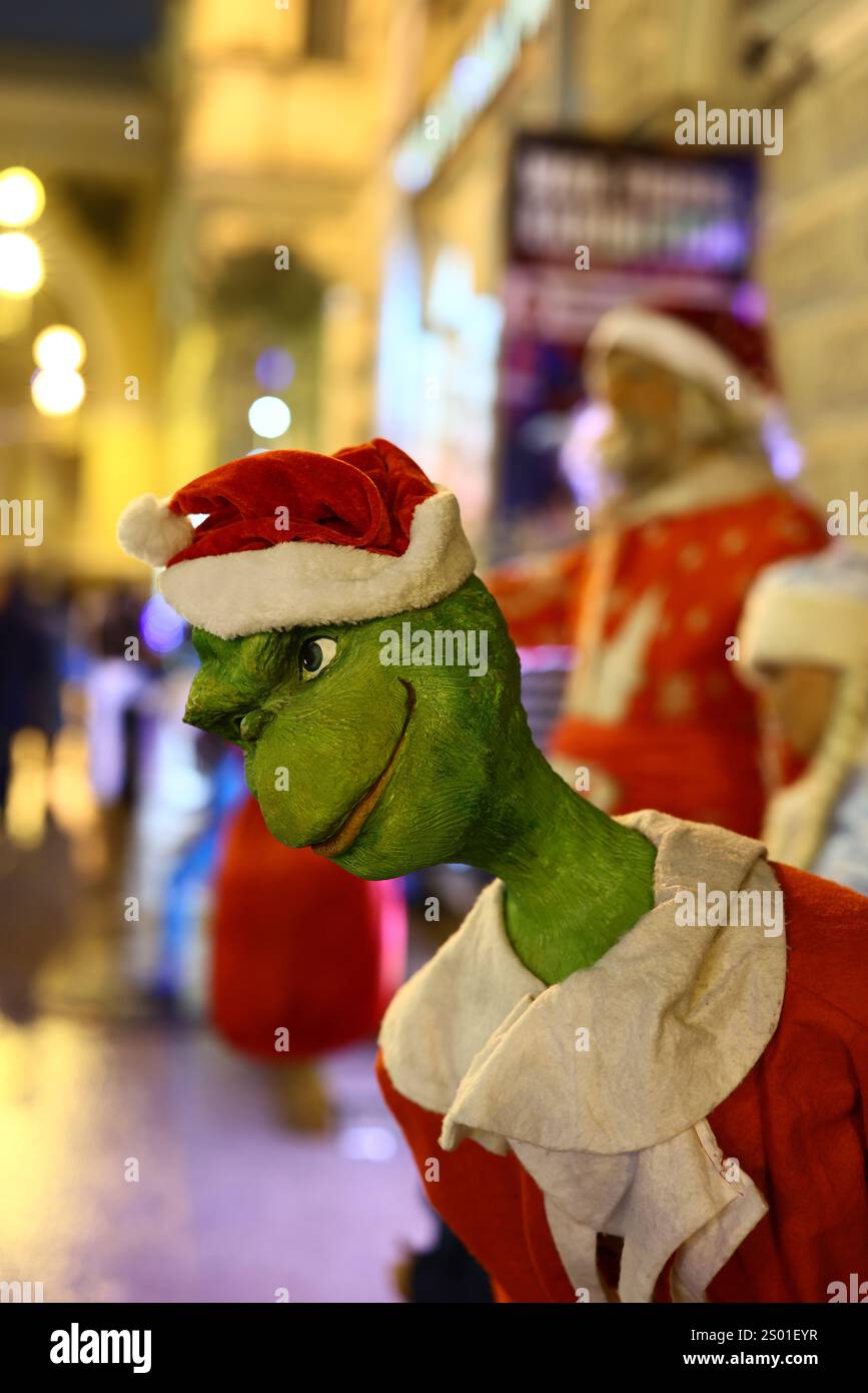 A Whimsical Grinch Doll Dressed in Festive Attire for the Holiday ...