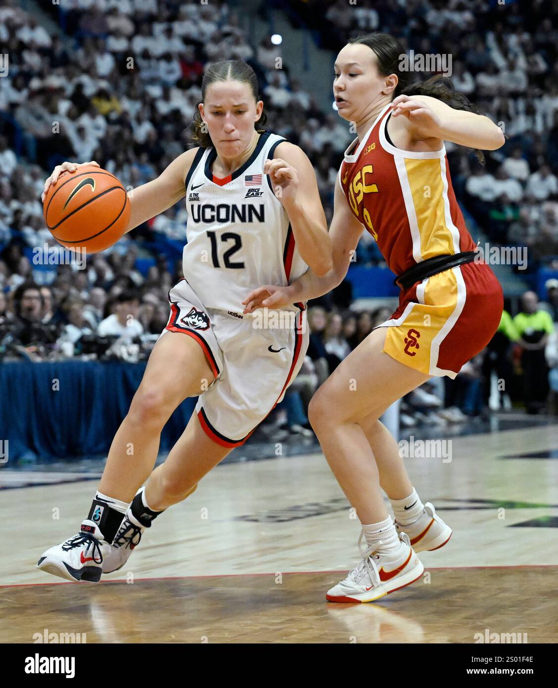 UConn guard Ashlynn Shade (12) is guarded by Southern California guard ...