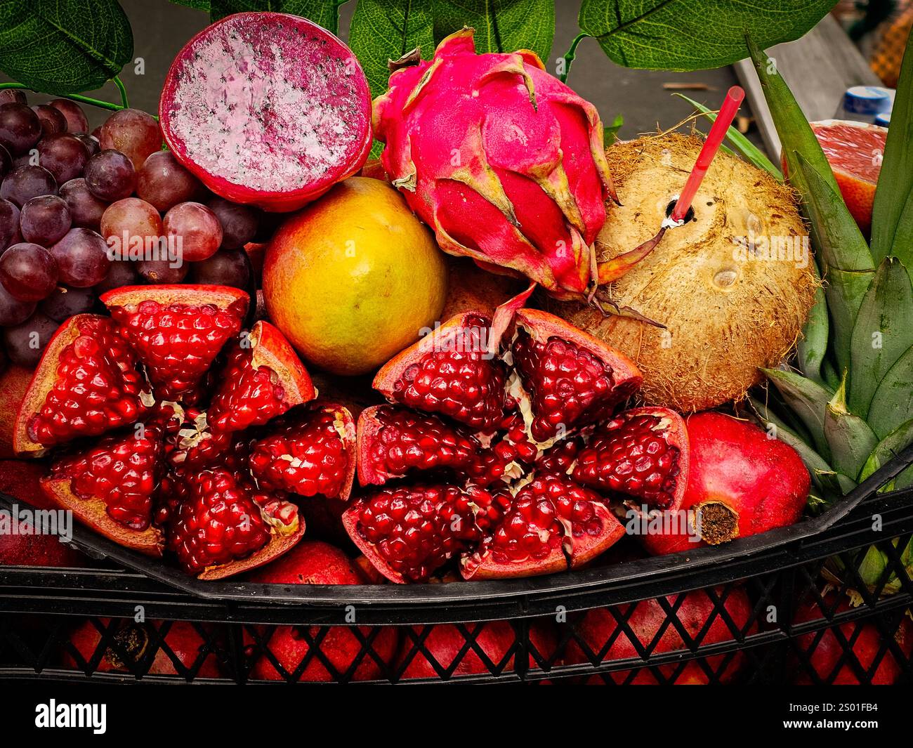 Colorful fruits for sale include pomegranate, pineapple, grapefruits ...