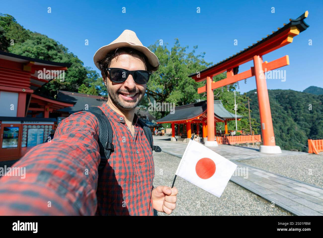 Handsome young tourist enjoying summer holiday in Japan - Traveling ...