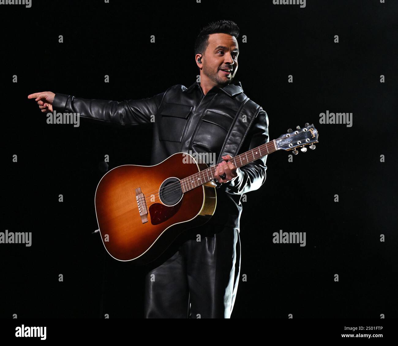 Hollywood FL, USA. 22nd Dec, 2024. Luis Fonsi performs during his “25 ...