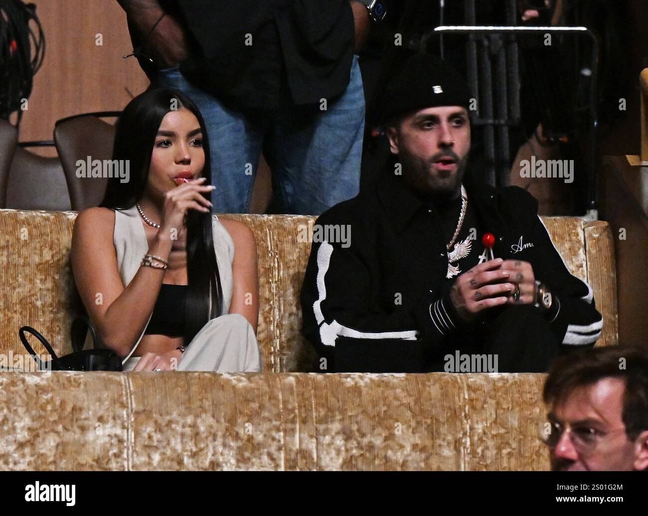 Hollywood FL, USA. 22nd Dec, 2024. Angelica Cruz and Nicky Jam watch as ...