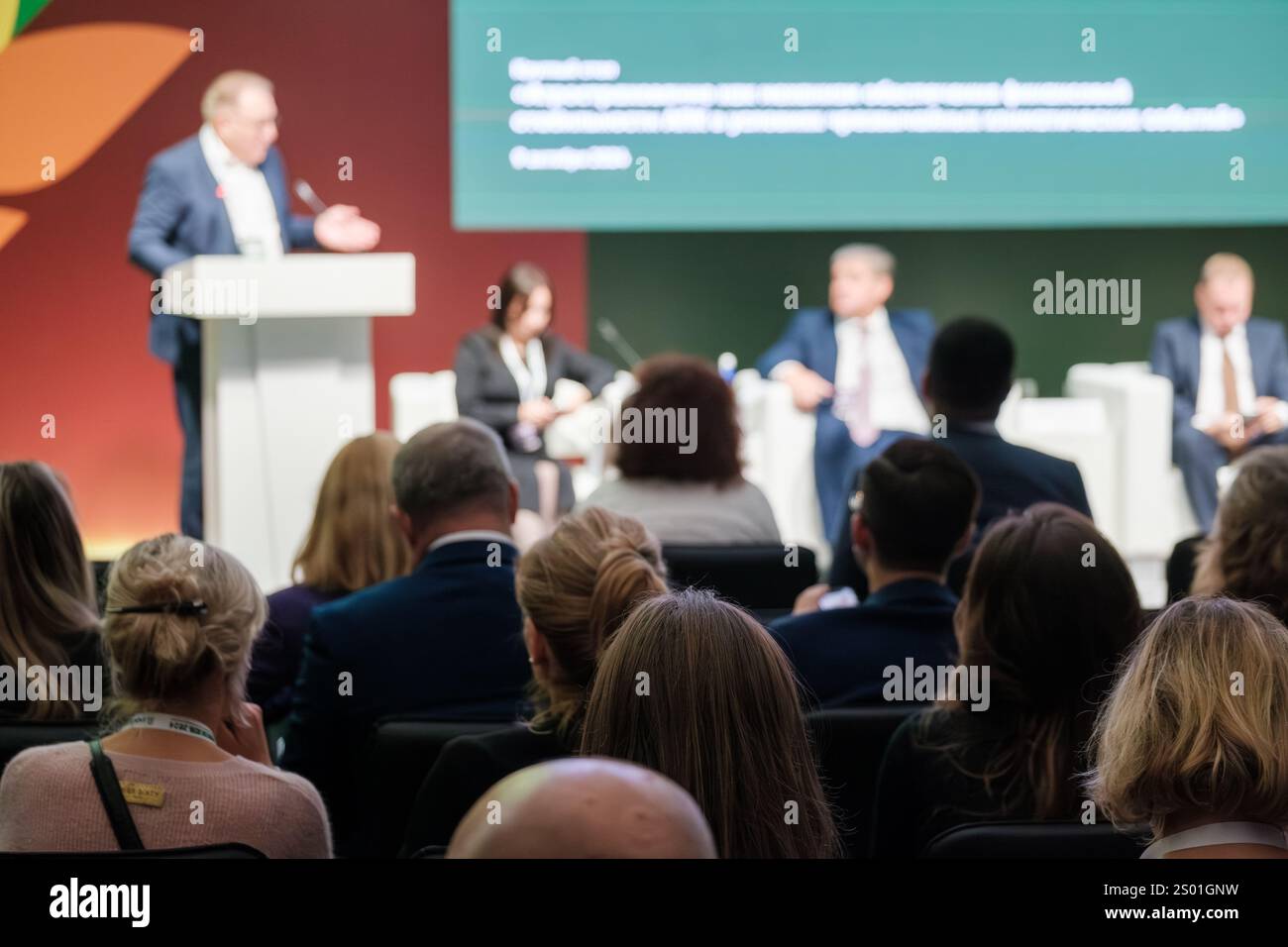 Business conference featuring panel discussion with professionals and ...