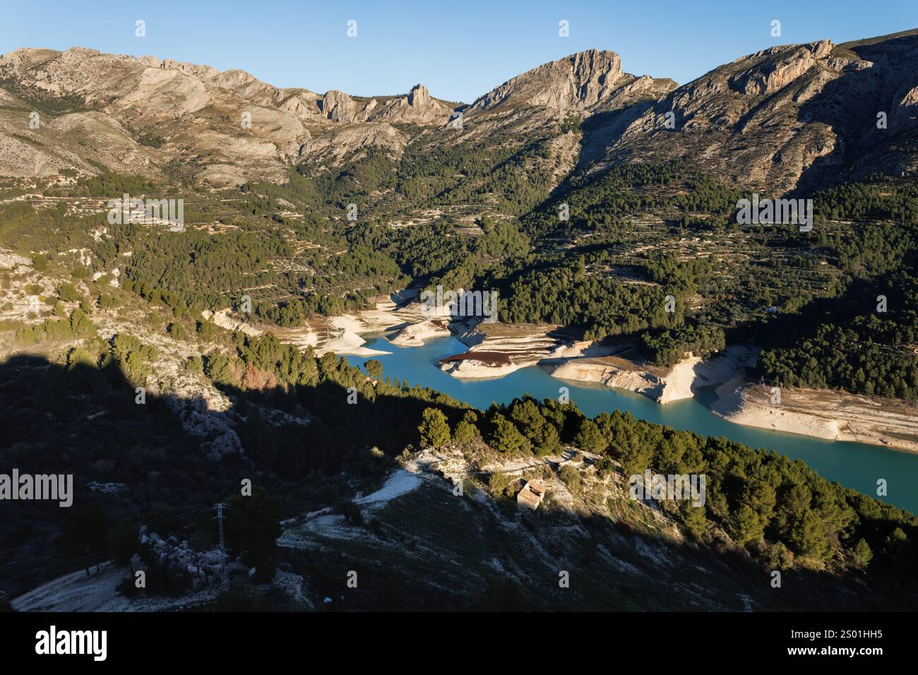 Mountain landscape with the Guadalest reservoir with little water due ...