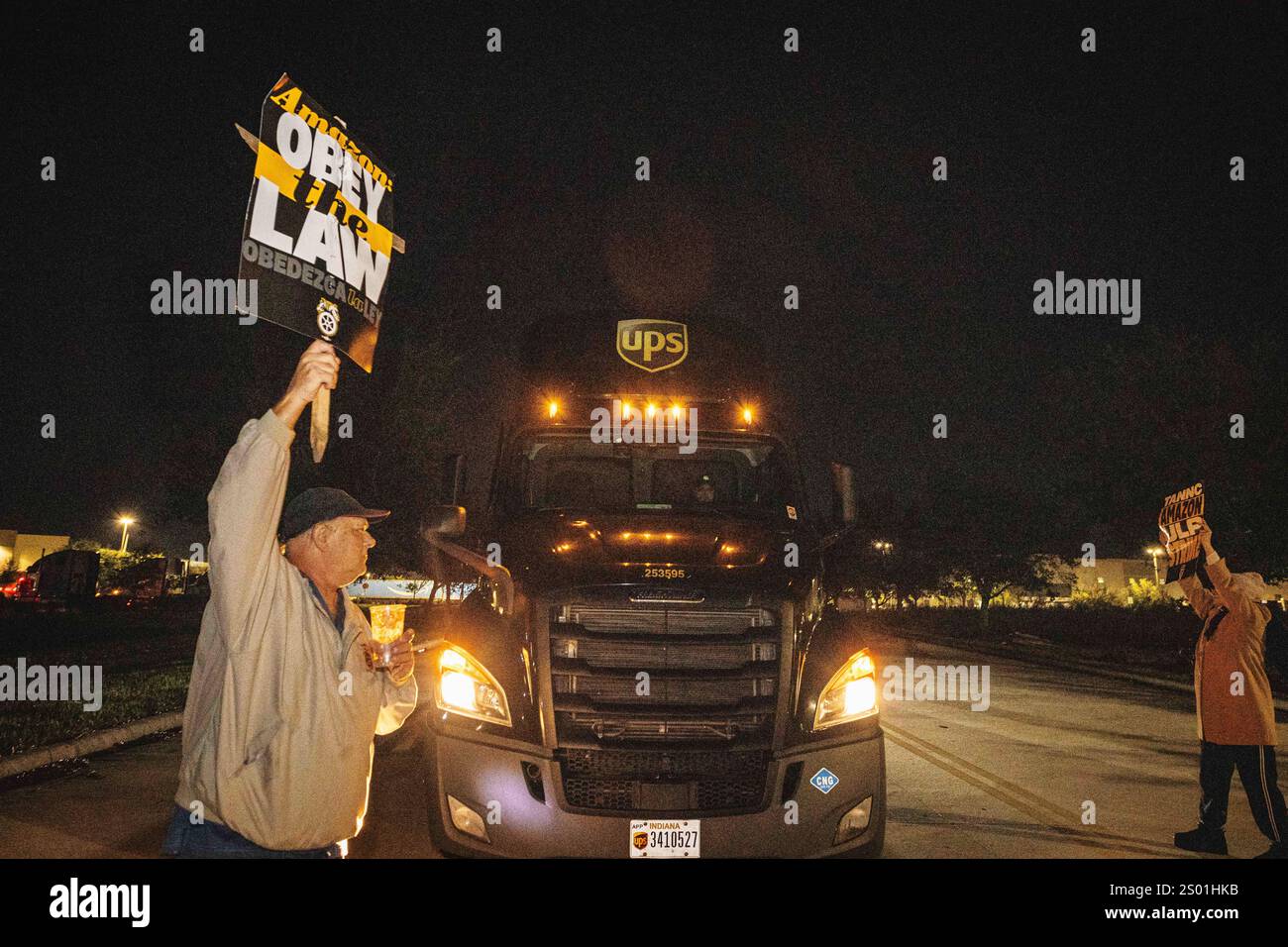 Ruskin, Florida, USA. 20th Dec, 2024. Protestors stop a UPS truck whom ...