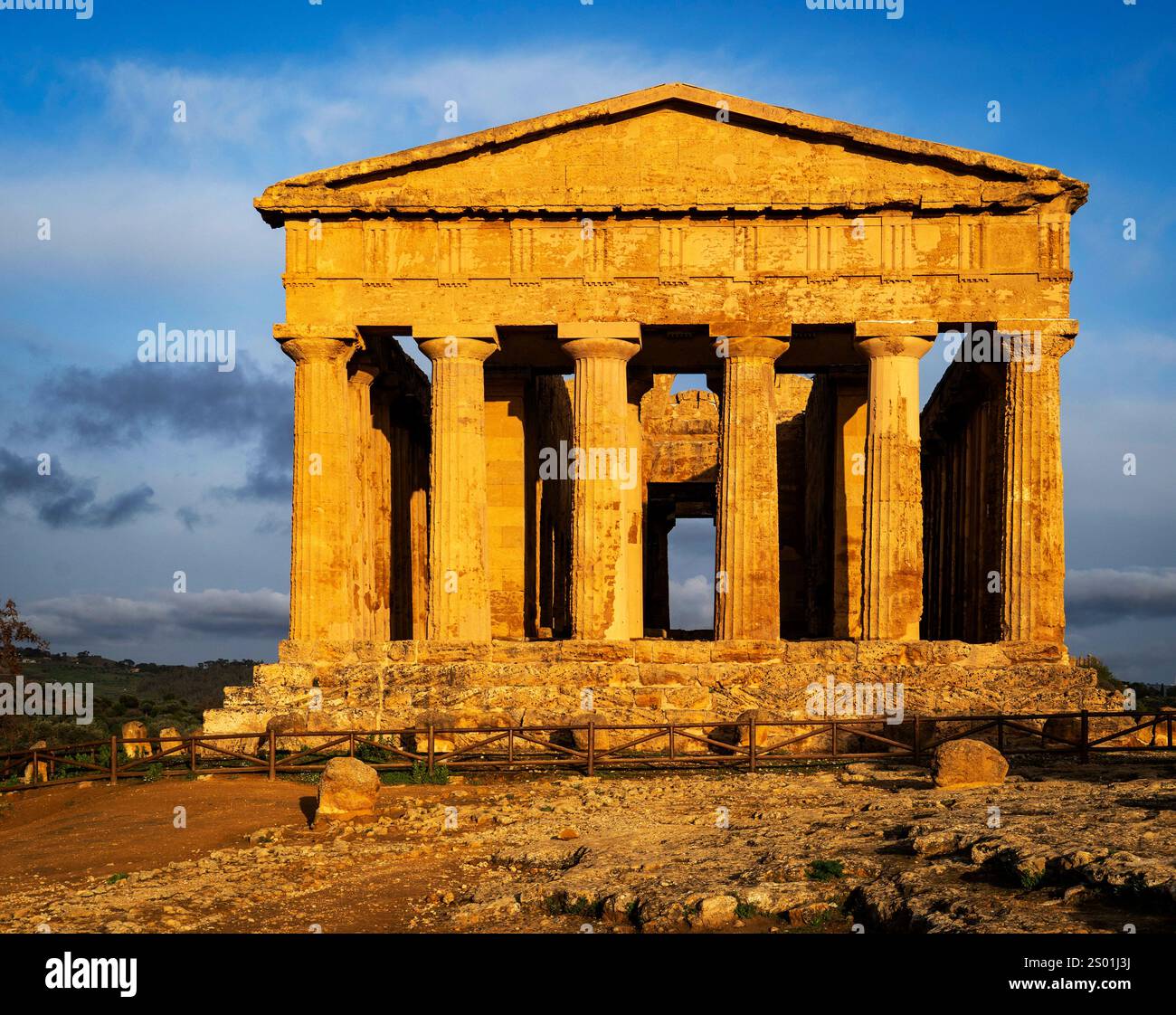A well-preserved ancient Greek temple with tall columns, set against a ...