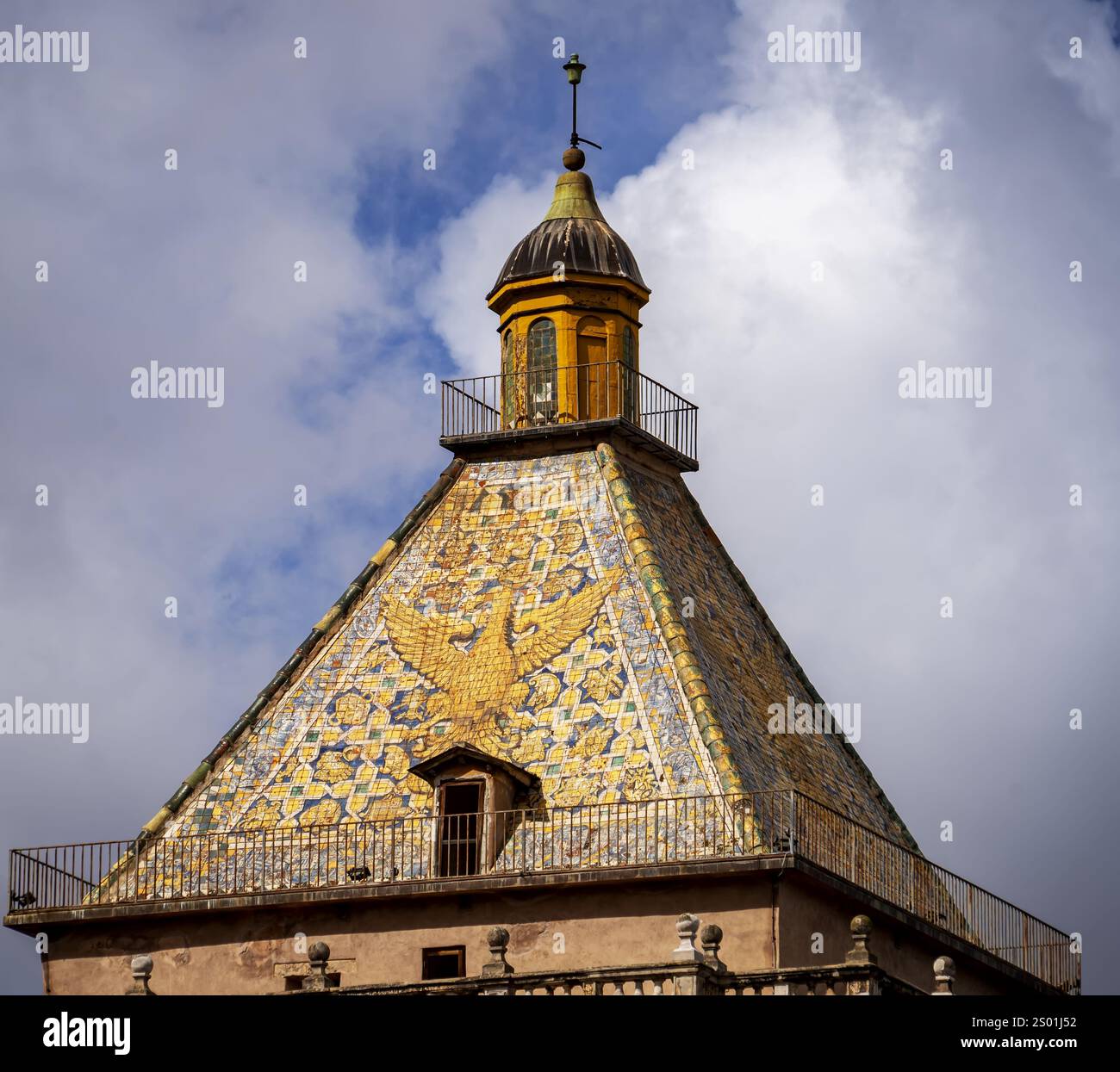 A close-up view of a decorative rooftop featuring intricate tile work ...