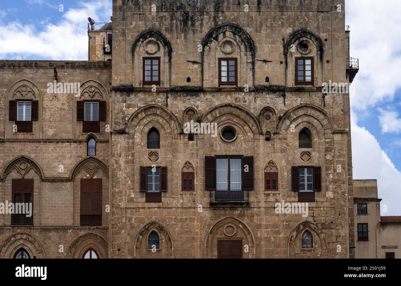 A historic stone building with intricate architectural details ...