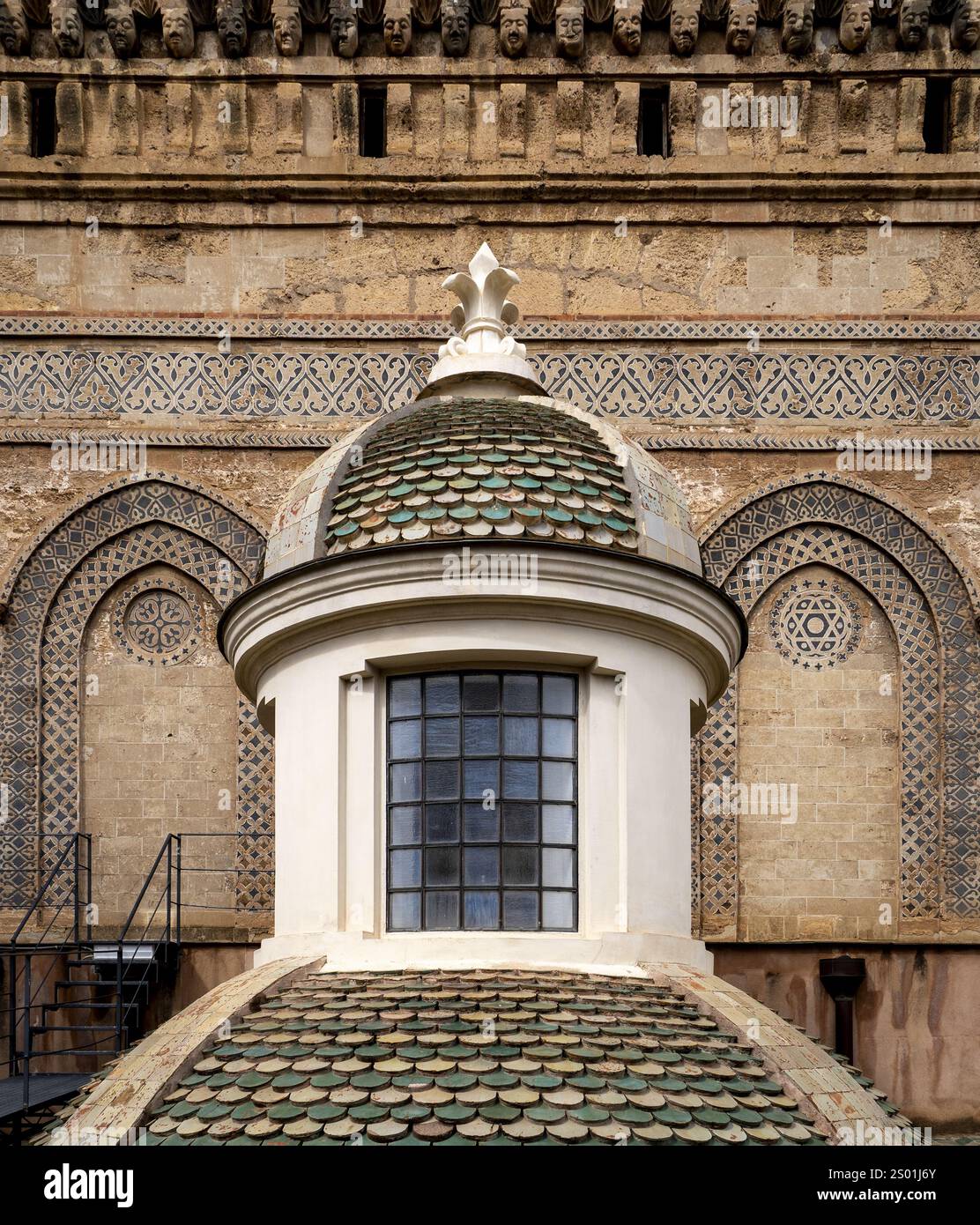A close-up view of a decorative dome with a unique shingle pattern, set ...