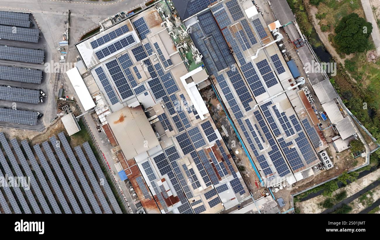 An aerial perspective shows a large industrial facility covered with ...