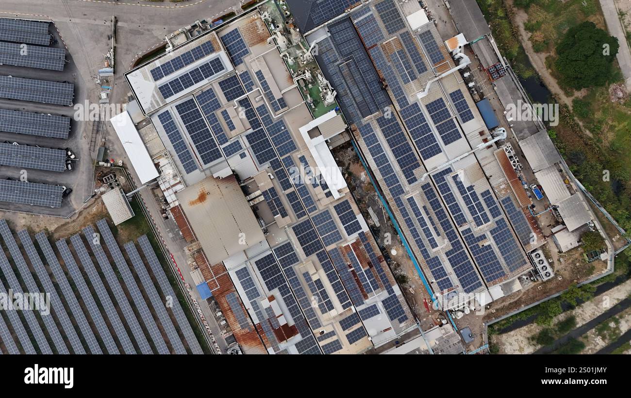 An expansive industrial site features numerous solar panels installed ...