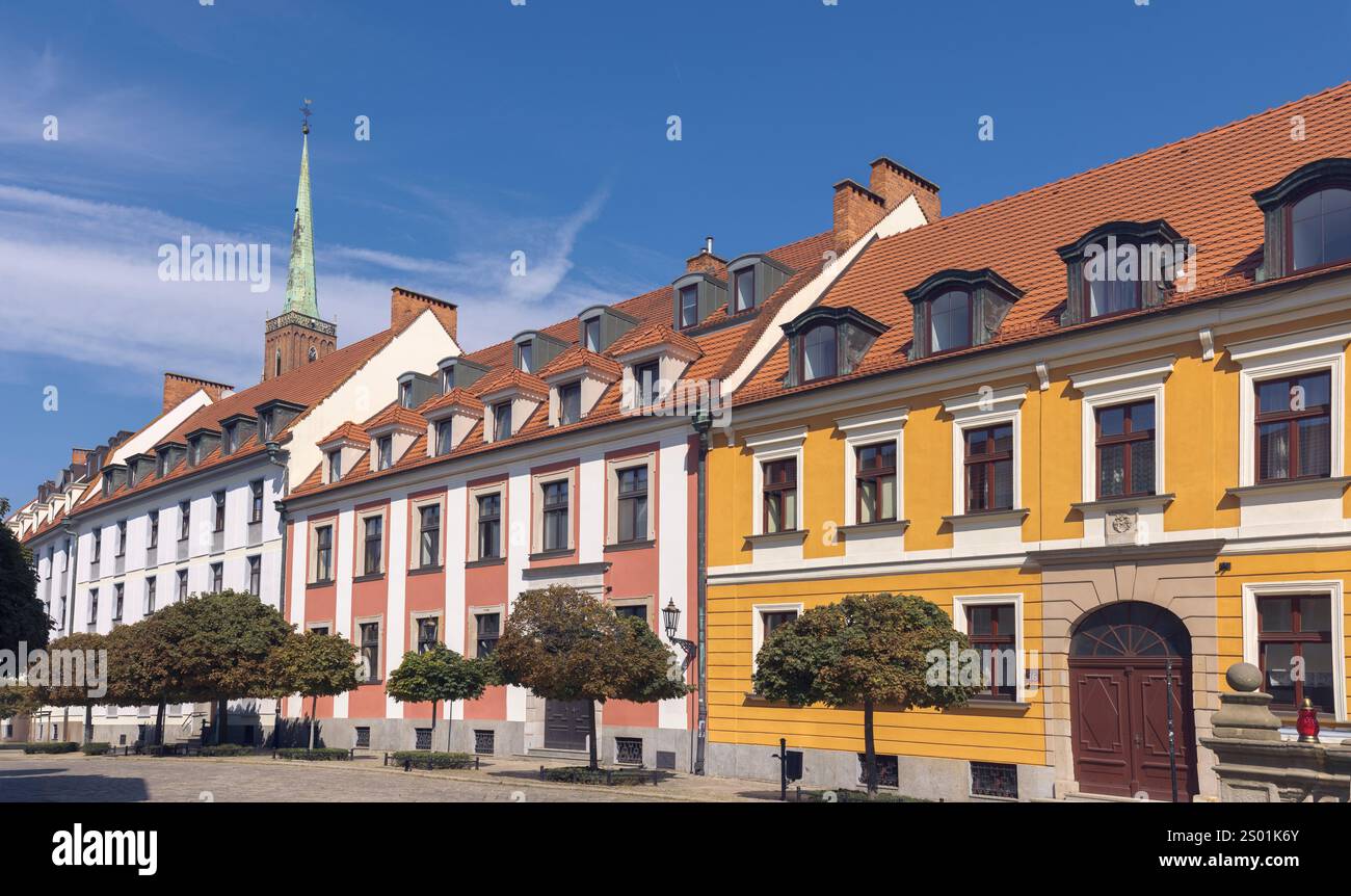 Vibrant buildings line Katedralna street, showcasing Ostrow Tumski's rich history and ...