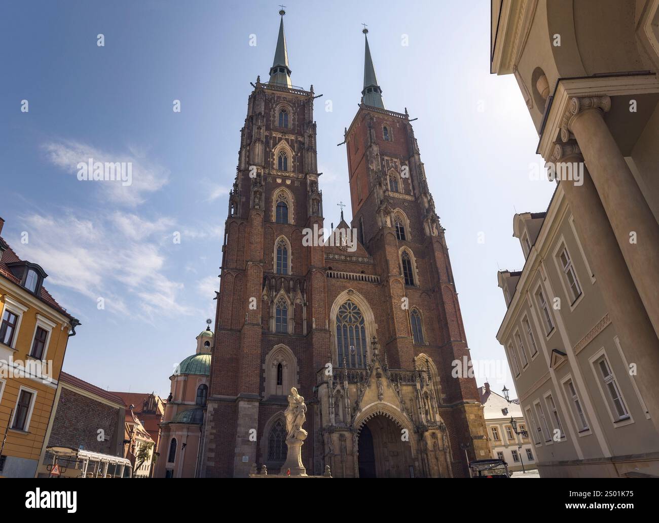 Two towering spires stand tall against a clear blue sky, showcasing ...
