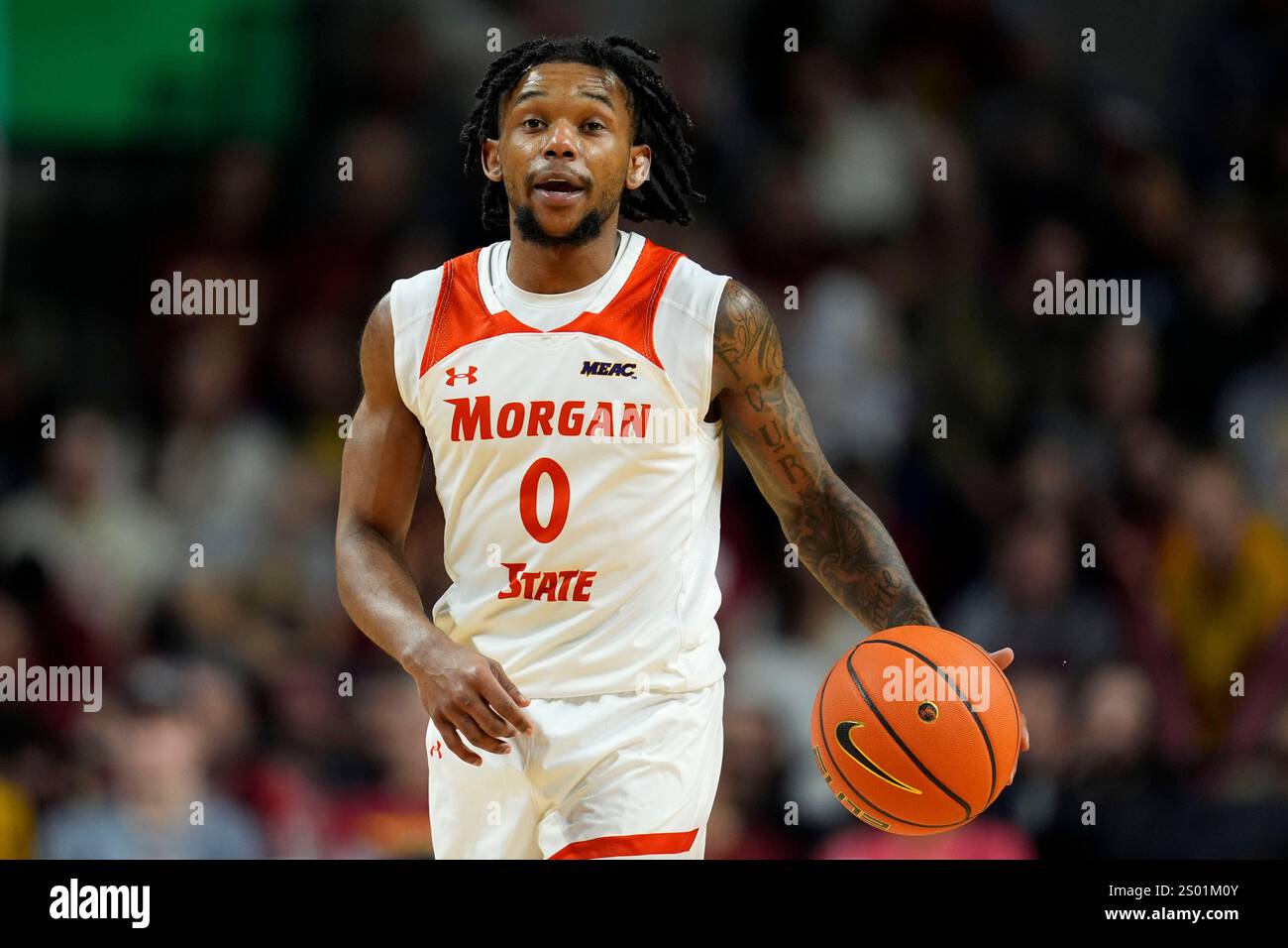 Morgan State guard Kameron Hobbs drives up court during the second half ...