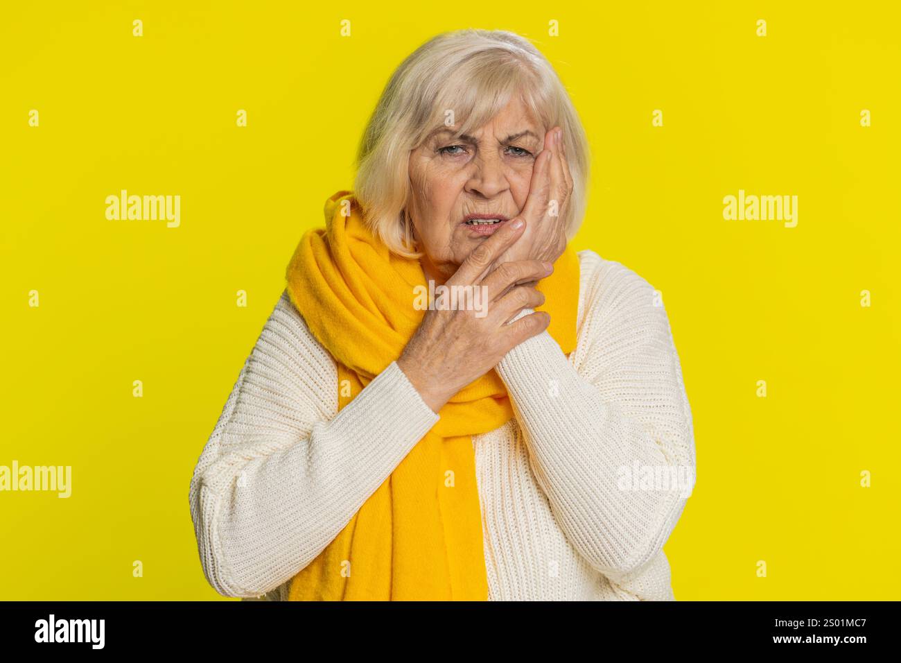 Dental problems. Senior old woman touching cheek, closing eyes with ...