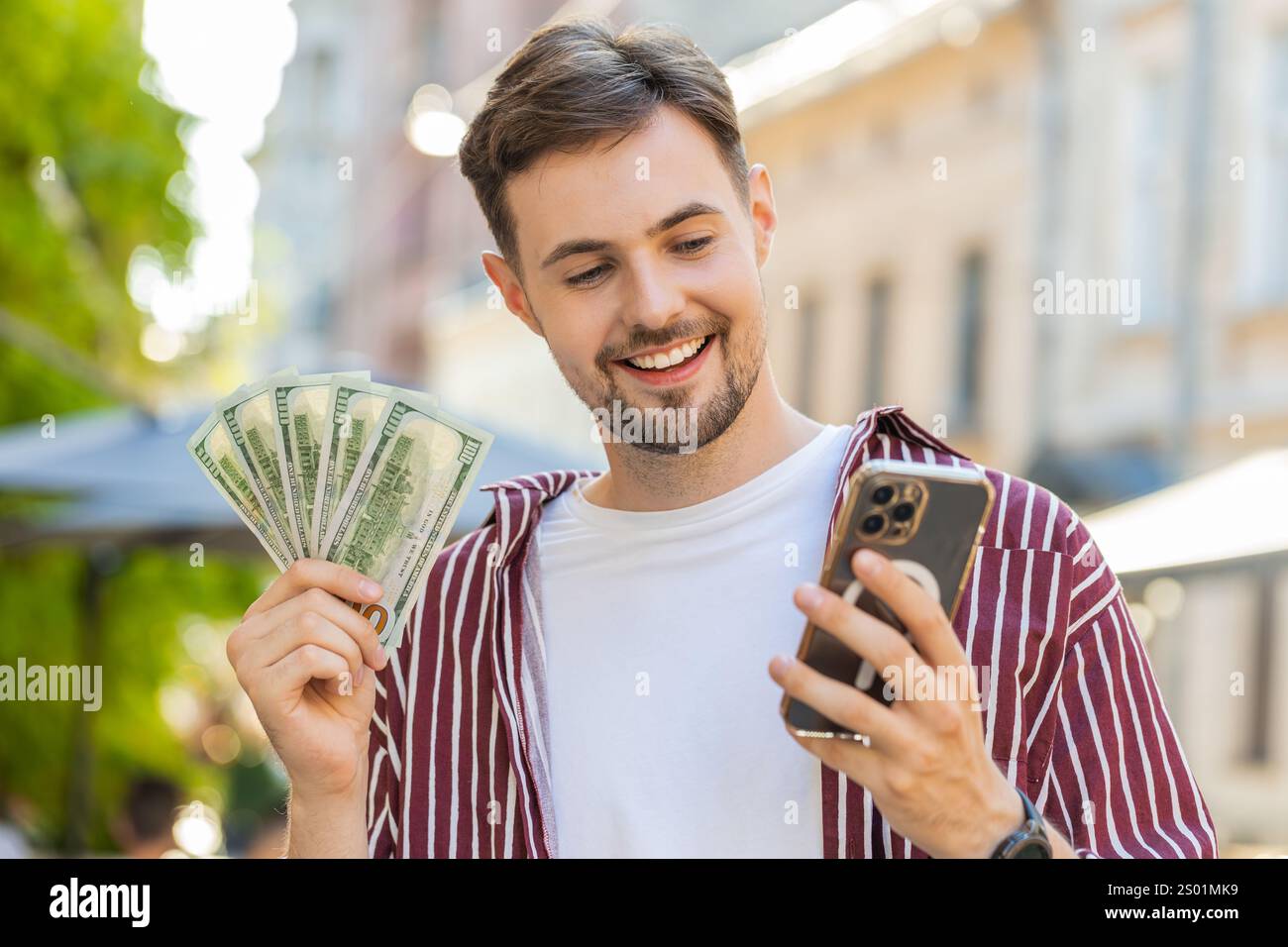 Smiling happy rich bearded man counting holding money dollar cash, use ...
