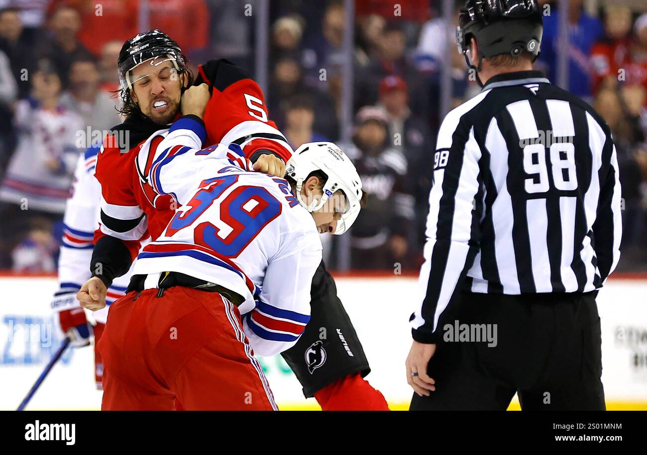 New York Rangers center Sam Carrick (39) and New Jersey Devils ...
