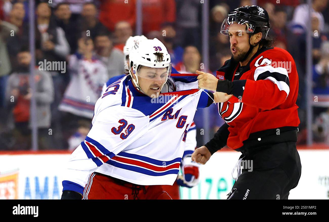New York Rangers center Sam Carrick (39) and New Jersey Devils ...