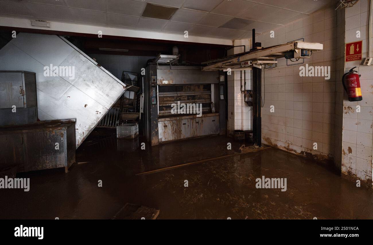 DANA flooding effects. Flood impacts, Valencia, Spain. Bakery oven and ...
