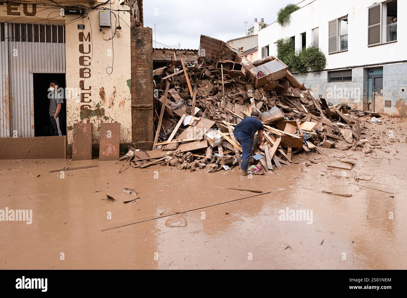 DANA flooding effects. Flood impacts, Valencia, Spain. Inhabitant in ...