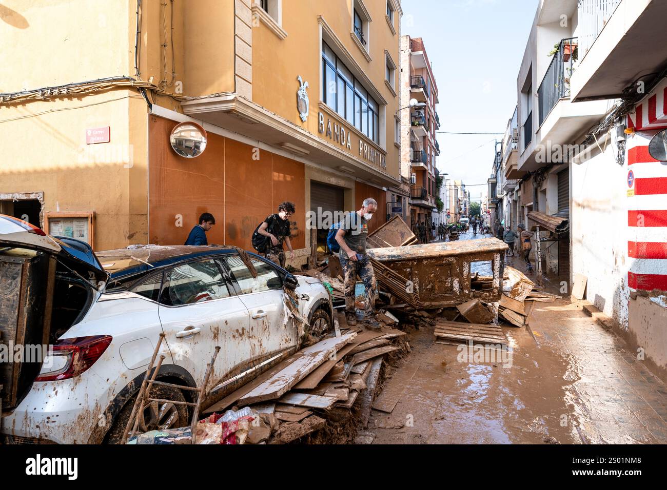 DANA flooding effects. Flood impacts, Valencia, Spain. People walking ...