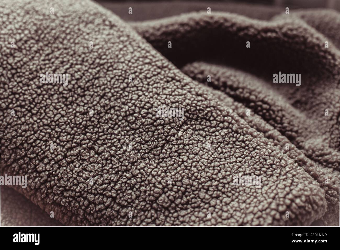 Brown fuzzy textile surface with a detailed close-up of its dense ...