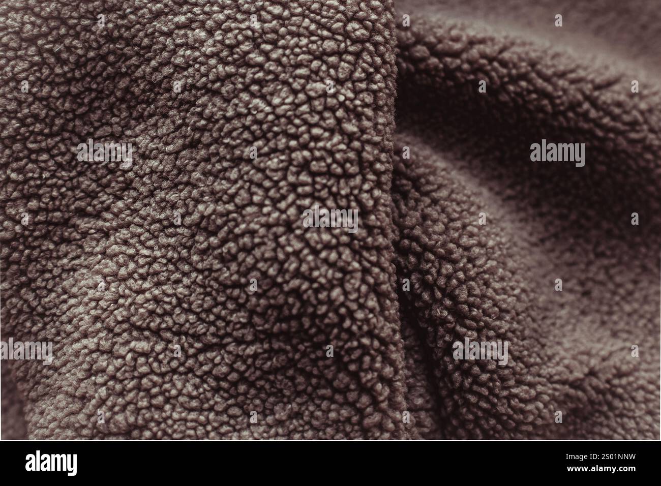 Brown fuzzy textile surface with a detailed close-up of its dense ...