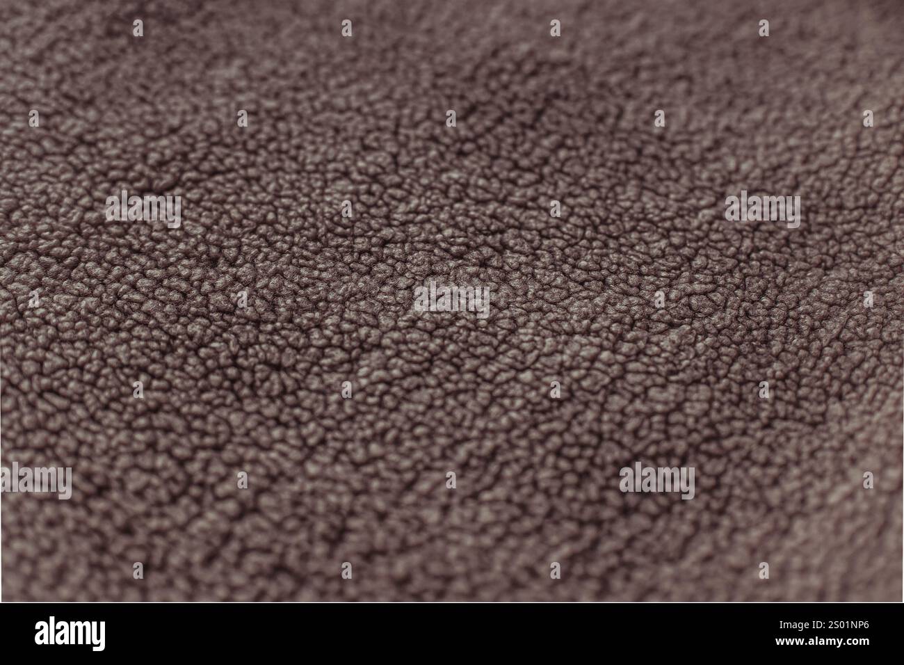 Brown fuzzy textile surface with a detailed close-up of its dense ...