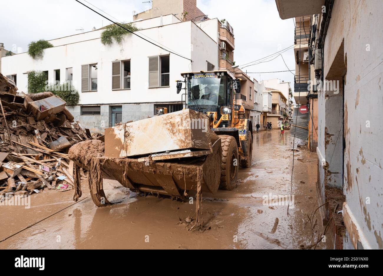DANA flooding effects. Flood impacts, Valencia, Spain. Excavator ...