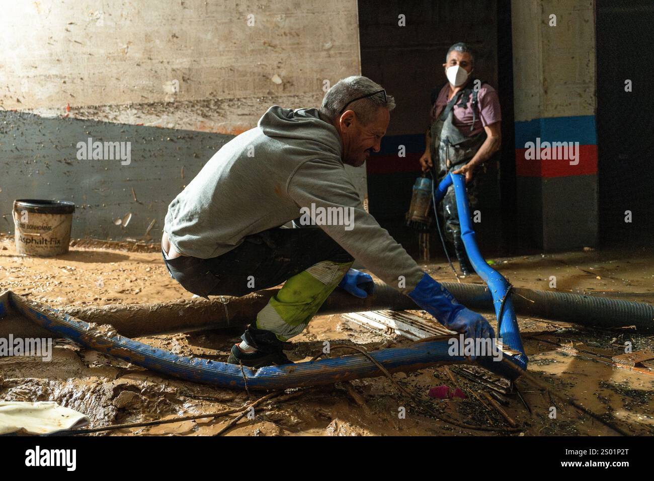 DANA flooding effects. Flood impacts, Valencia, Spain. Workers mud ...