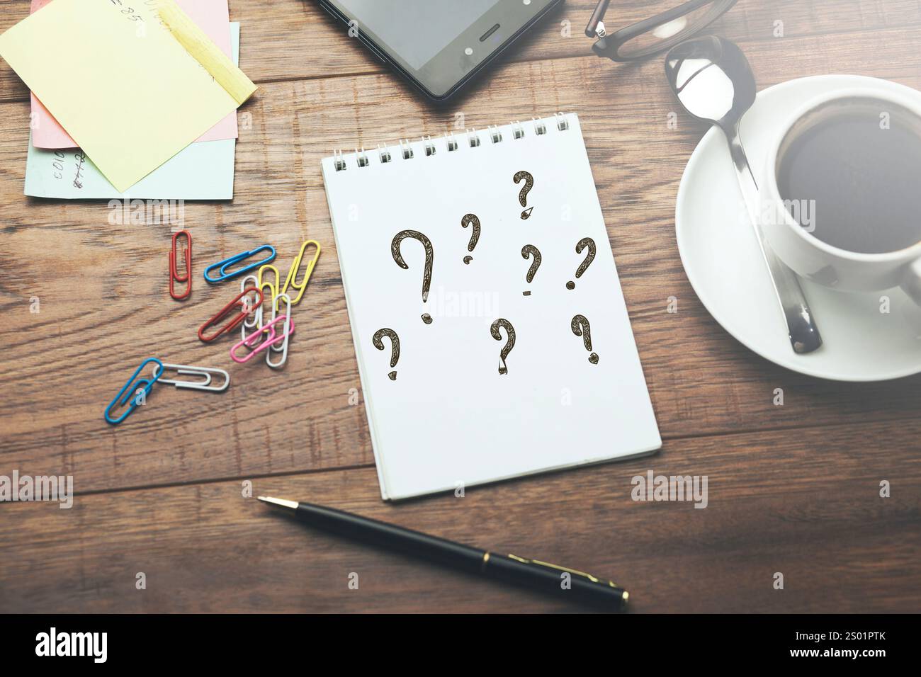 Question Mark written on a white notebook Stock Photo - Alamy