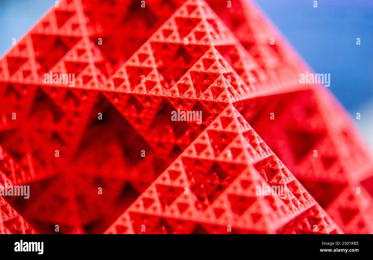 Art object printed on 3D printer from red melted plastic close-up ...