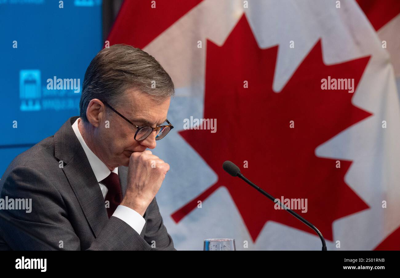 Ottawa, Canada. 11th Dec, 2024. Bank of Canada Governor Tiff Macklem waits for a news conference ...