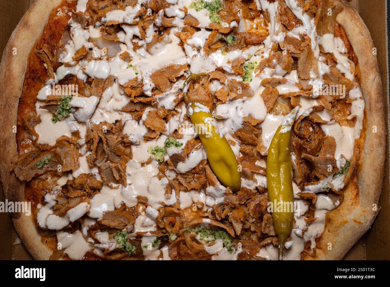 The famous Swedish kebab pizza, topped with green fefferoni peppers and ...