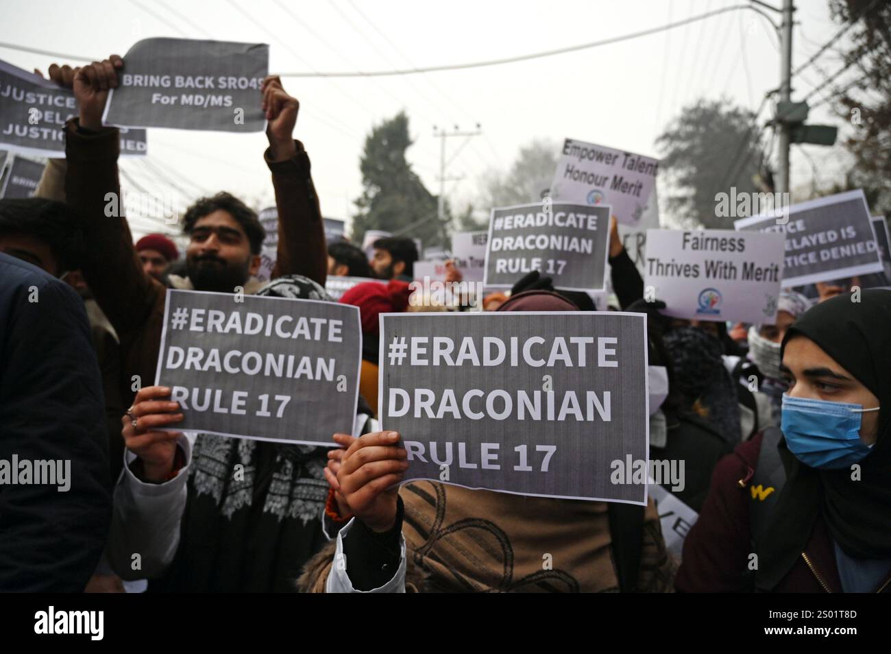SRINAGAR, INDIA - DECEMBER 23: Students take part in a protest outside ...