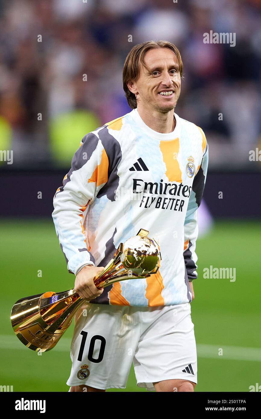 MADRID, SPAIN - DECEMBER 22: Luka Modric of Real Madrid presents the ...