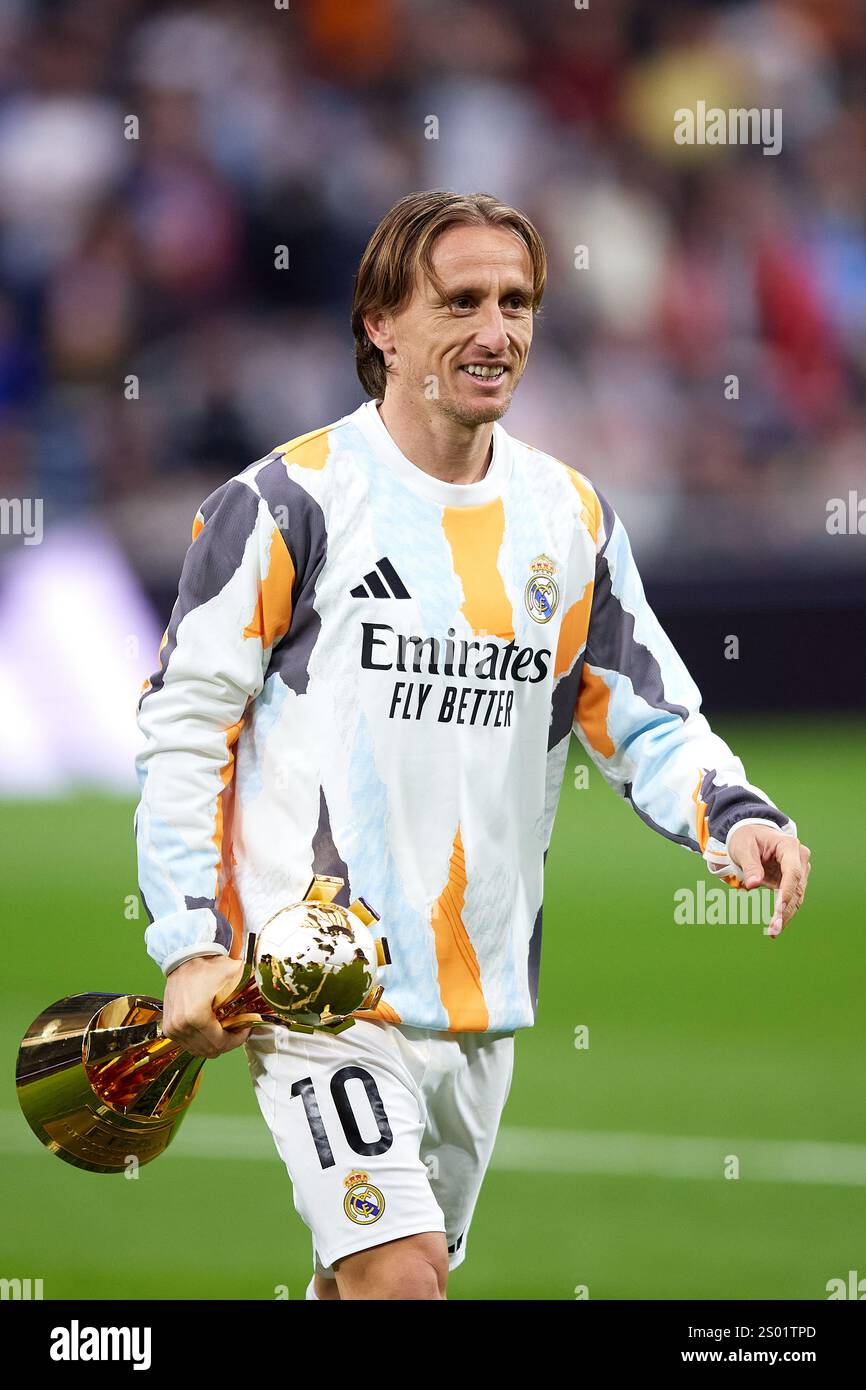 MADRID, SPAIN - DECEMBER 22: Luka Modric of Real Madrid presents the ...