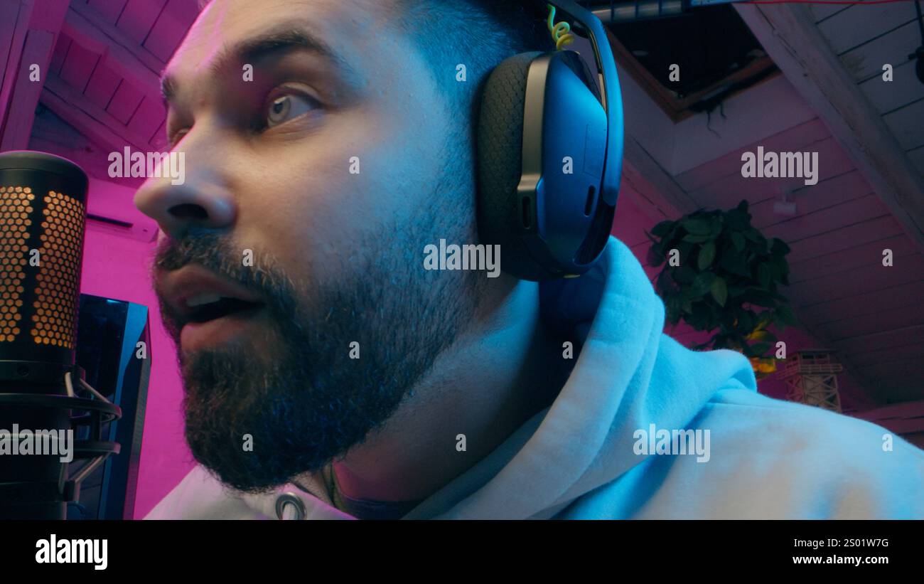 Happy Caucasian male gamer blogger vlog close up talking microphone ...