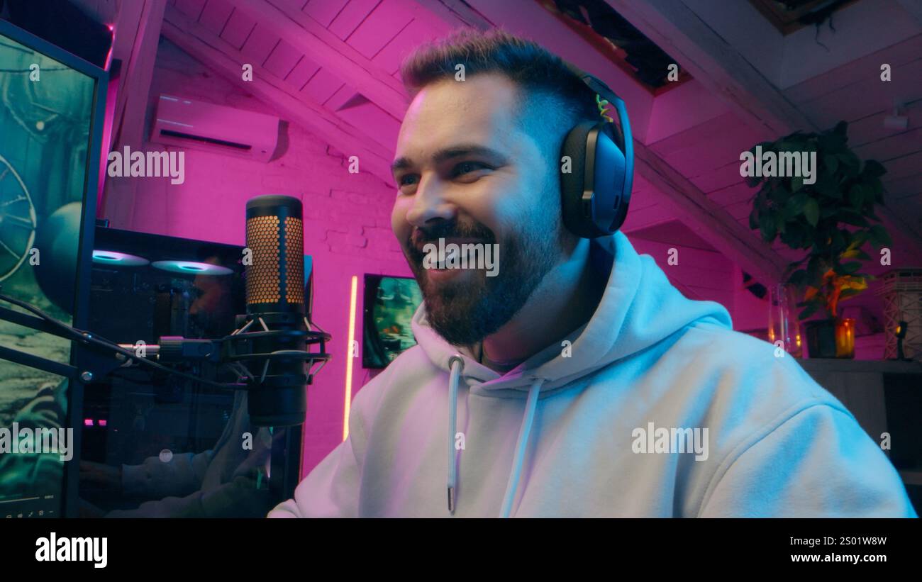 Happy Caucasian male gamer blogger vlog close up talking microphone ...