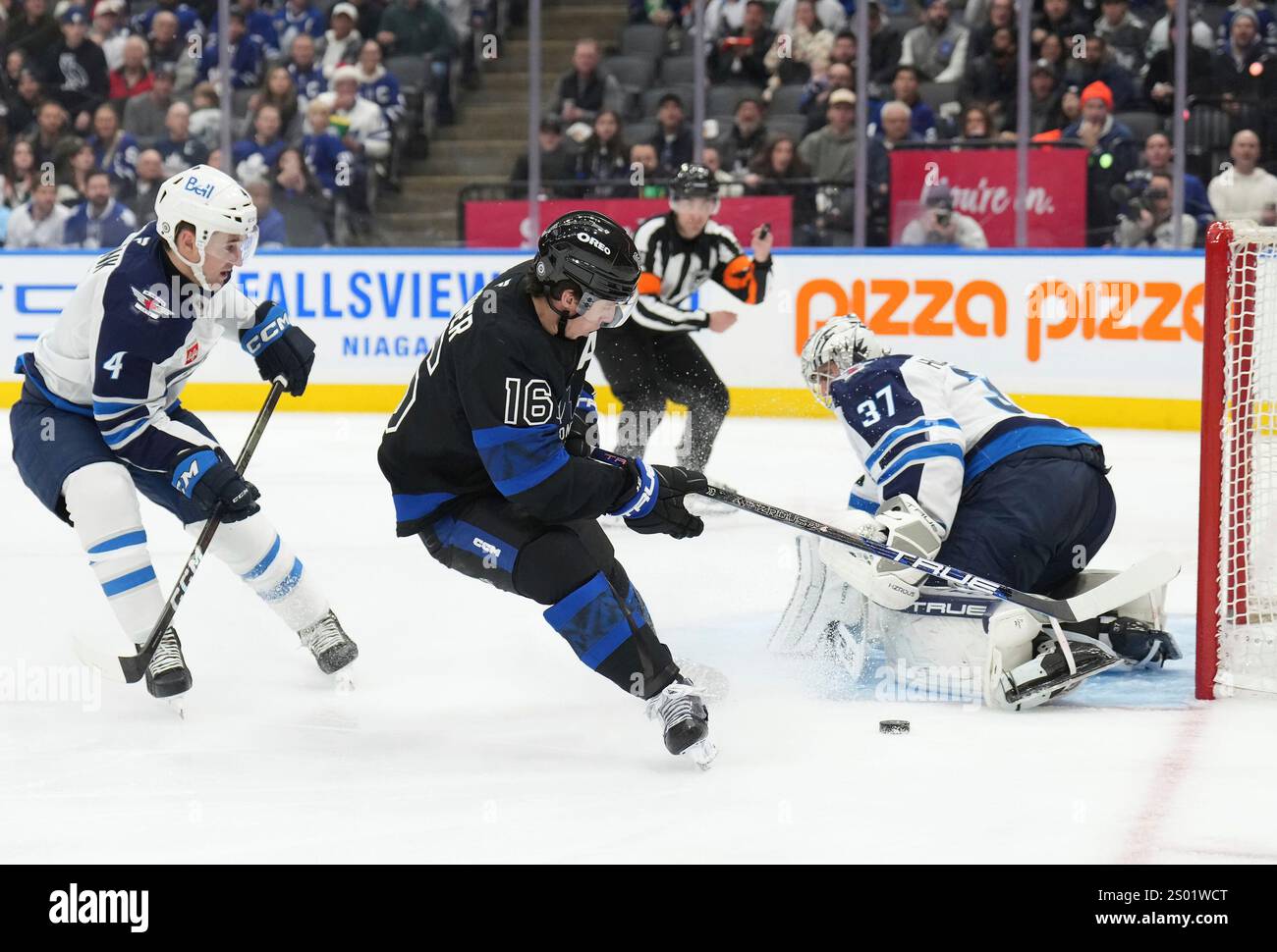 Toronto Maple Leafs right wing Mitch Marner (16) misses hitting the net ...