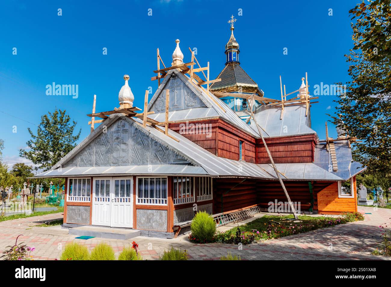 A large, old building with a steeple and a cross on top. The building ...