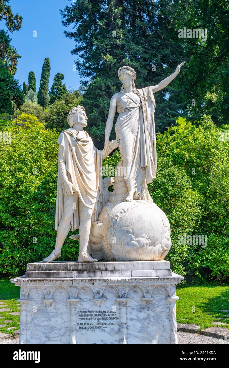 The statue of Dante and Beatrice stands gracefully in the lush gardens ...