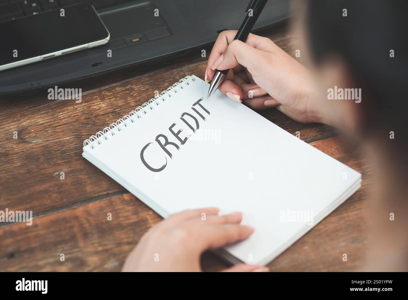 woman write credit text on a notebook with keyboard Stock Photo - Alamy
