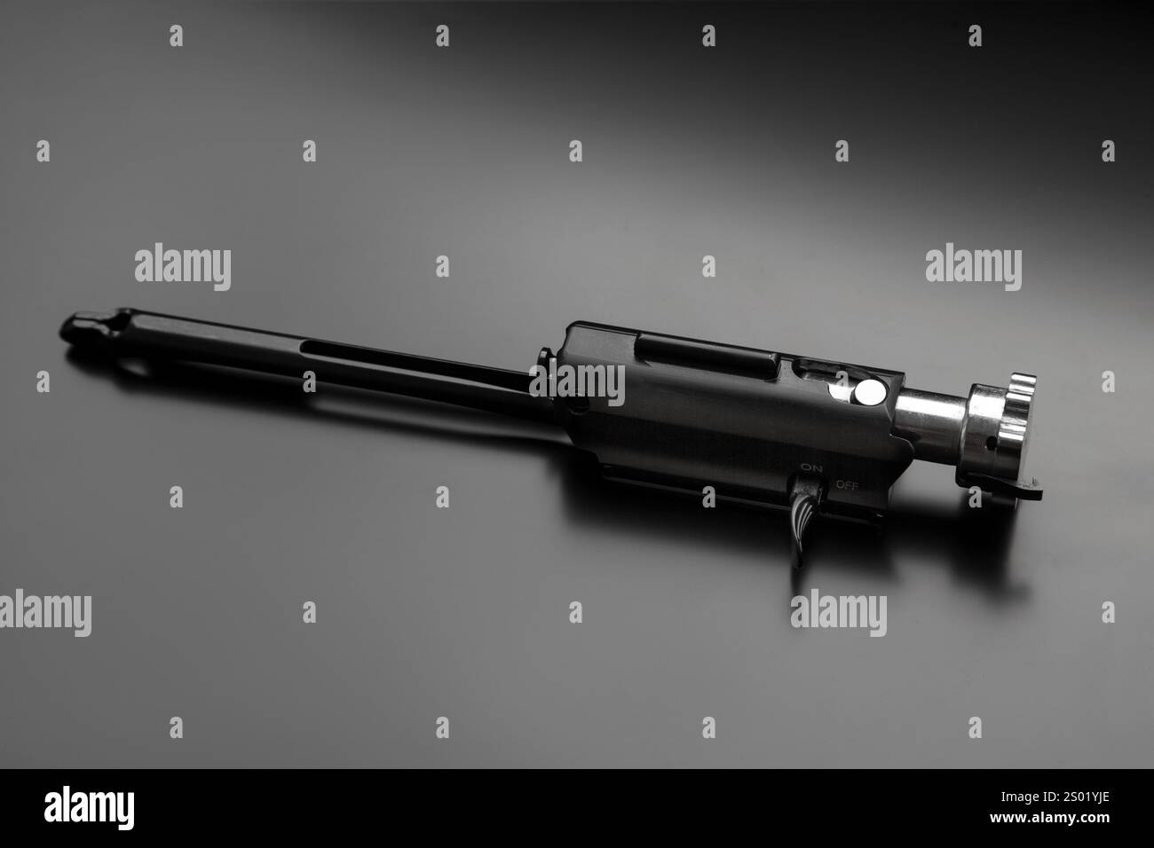 Bolt of a semi-automatic shotgun, isolated on a dark background ...