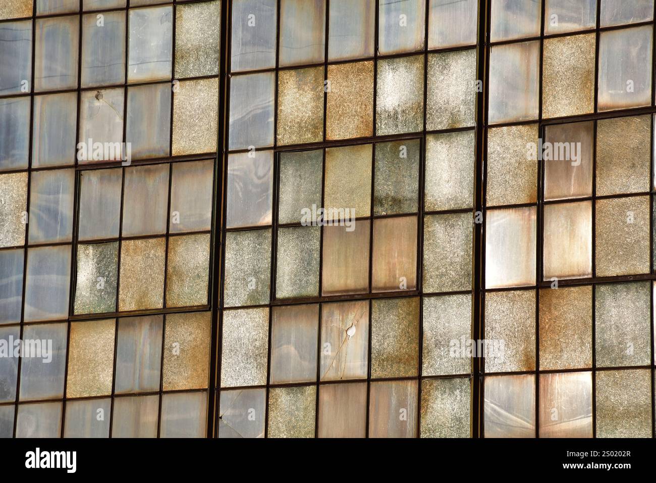 Industrial building windows of different colors and texture. Old ...