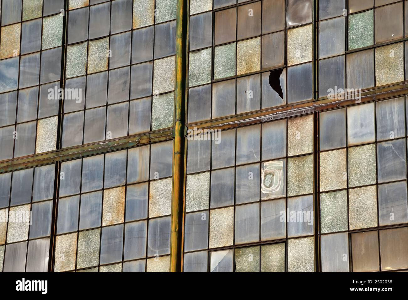 Industrial building windows of different colors and texture. Old ...