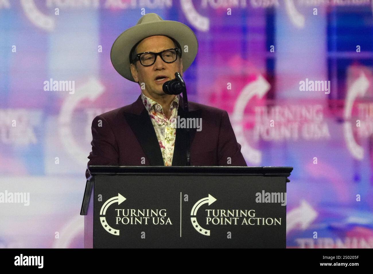 Rob Schneider speaks at AmericaFest, Sunday, Dec. 22, 2024, in Phoenix ...